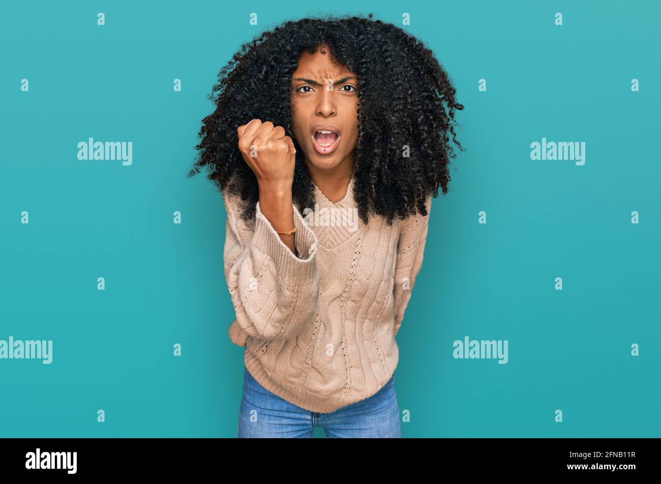 Young african american girl wearing casual clothes angry and mad ...