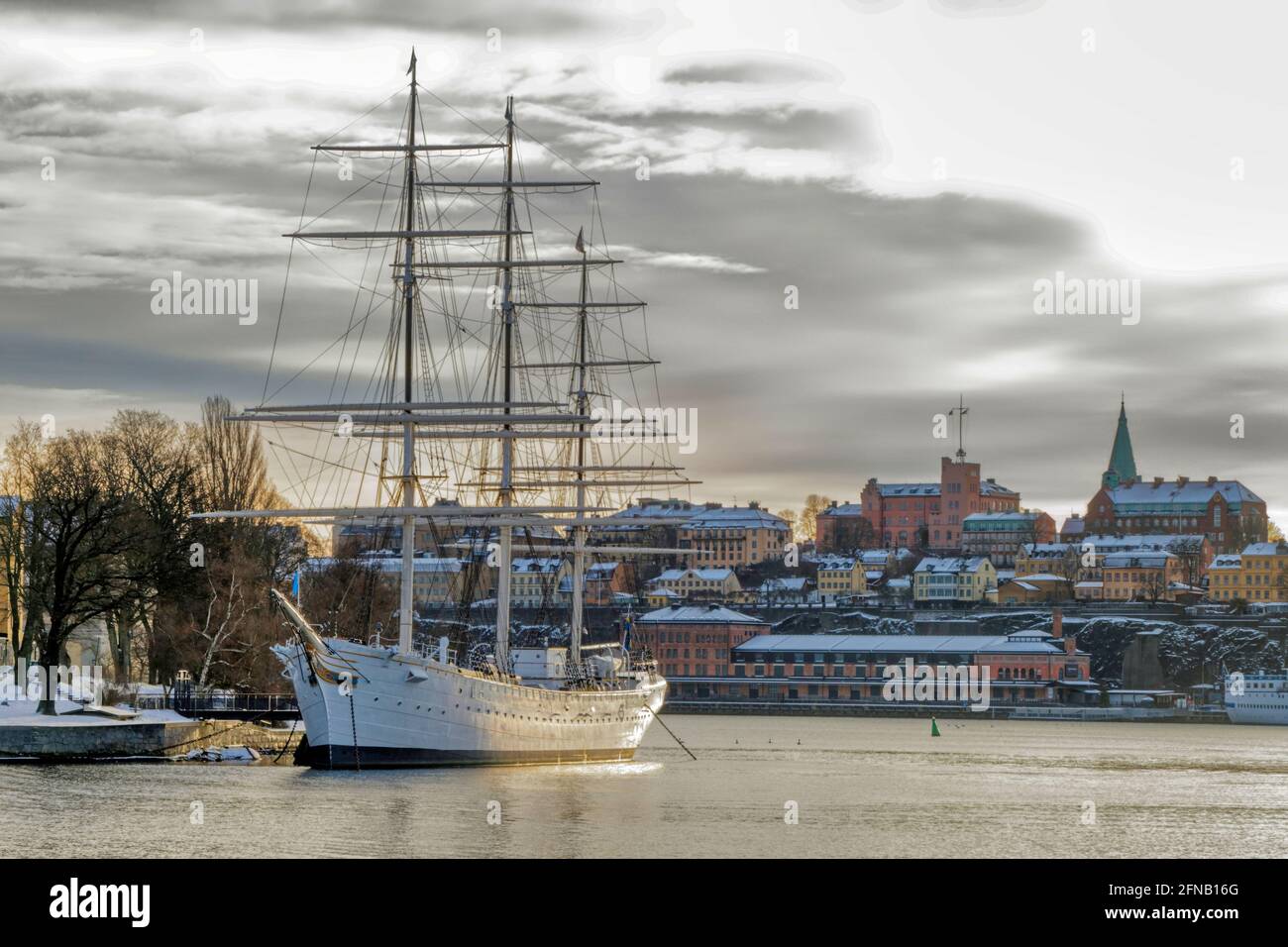 A large ship near docks in Stockholm, Sweden with gray clouds in ...
