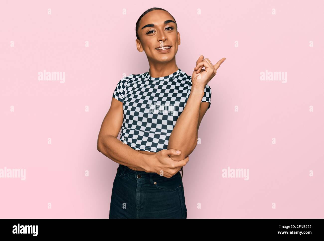 Hispanic transgender man wearing make up and long hair wearing modern ...