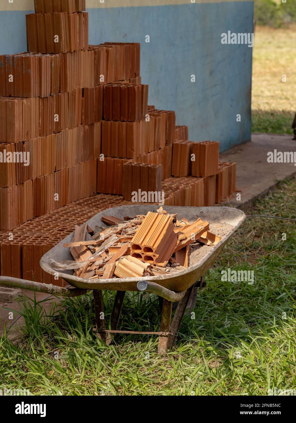 Wheelbarrow to transport ceramic bricks under construction Stock Photo ...