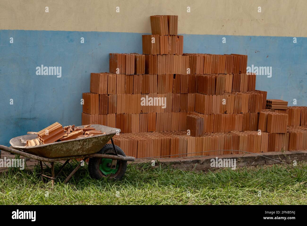 Wheelbarrow to transport ceramic bricks under construction Stock Photo ...