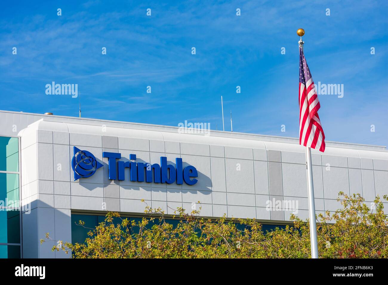 Trimble sign, logo on headquarters. Trimble develops positioning ...