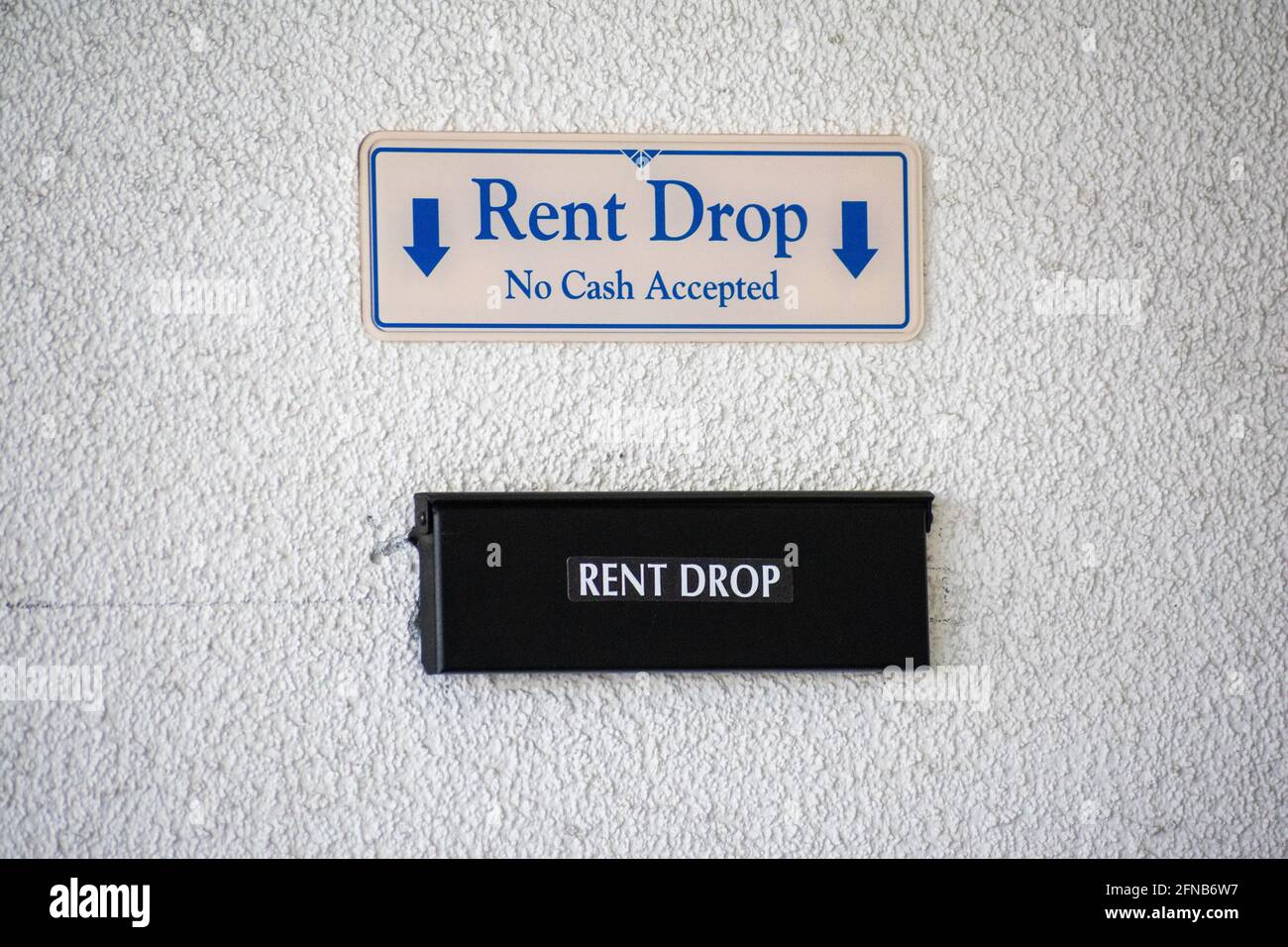 Rent Drop, No cash accepted sign with down arrow pointing to flap of ...