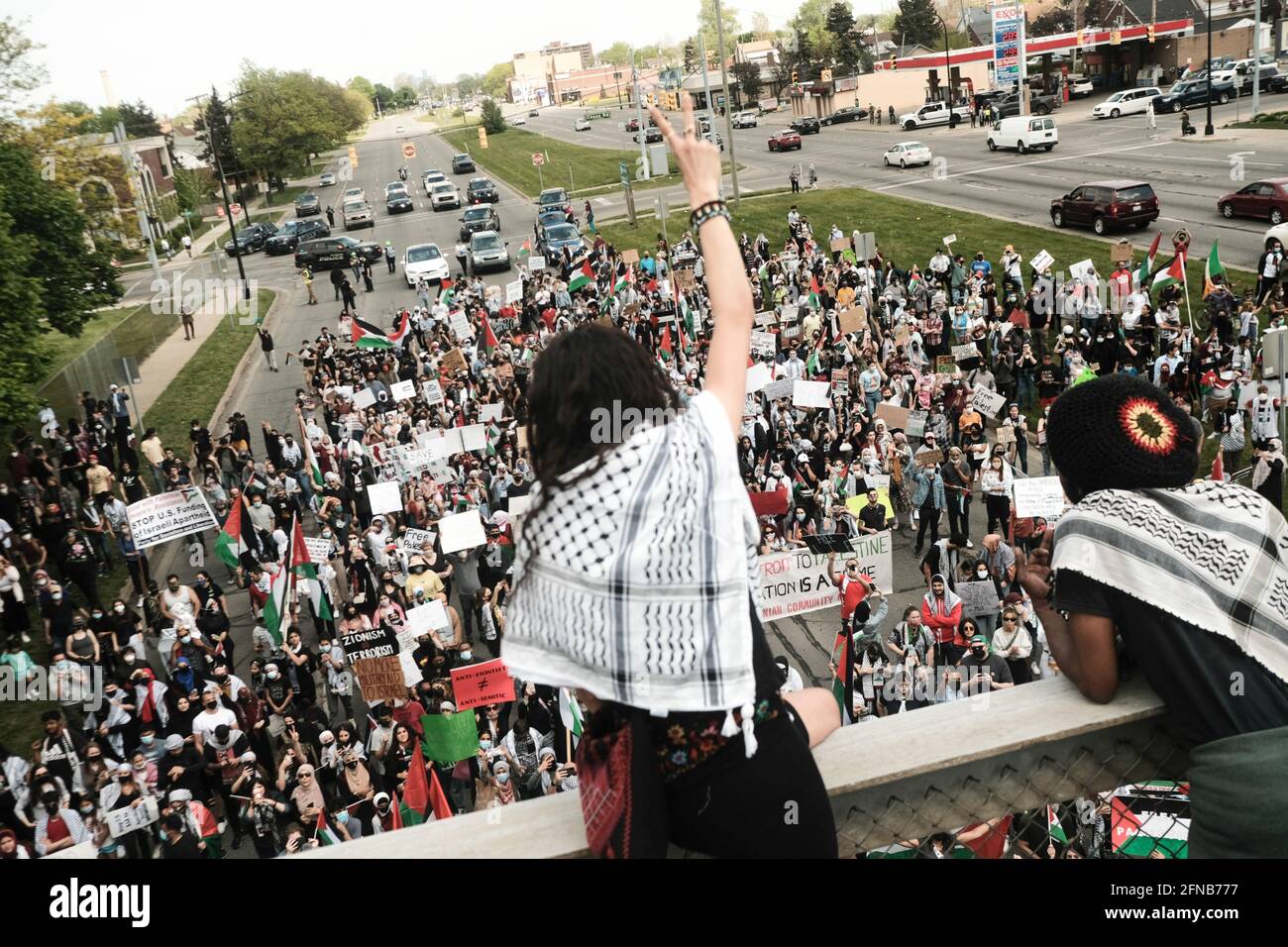 Protesters marching through the streets of Dearborn during a large free ...