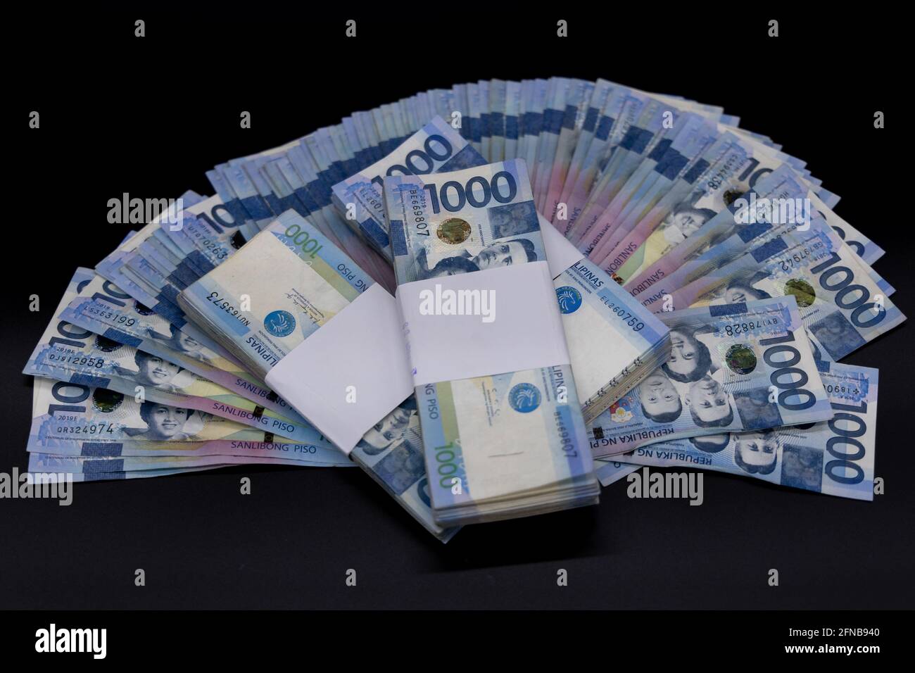 A pile of one thousand Philippines banknotes. Cash of Thousand dollar ...