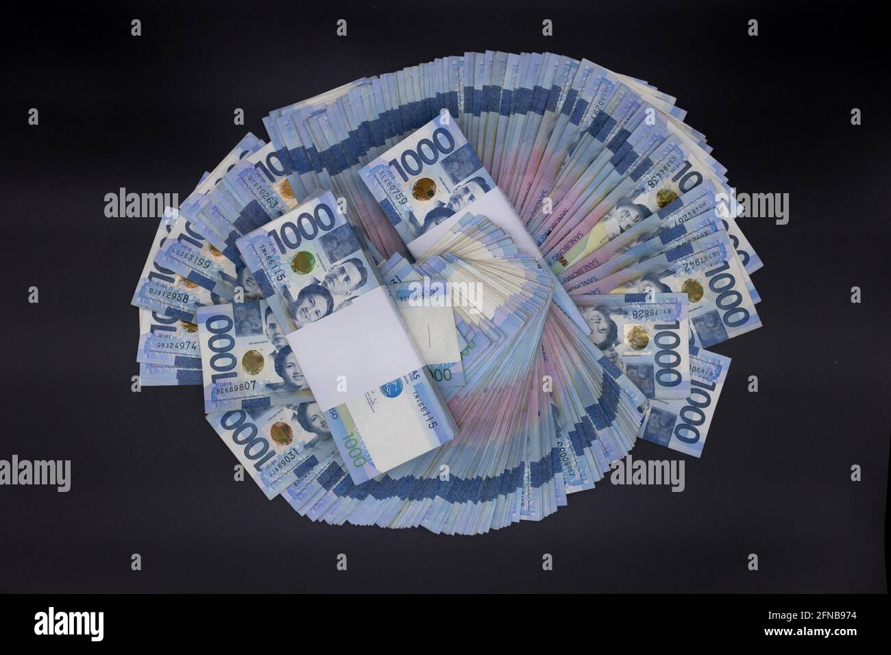 A pile of one thousand Philippines banknotes. Cash of Thousand dollar ...