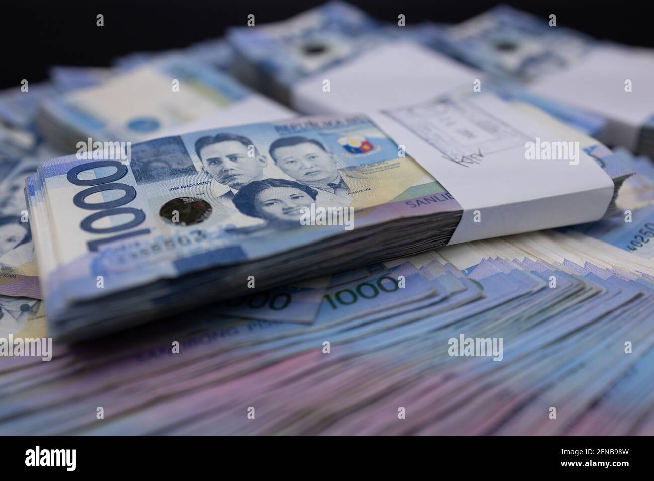 A pile of one thousand Philippines banknotes. Cash of Thousand dollar ...