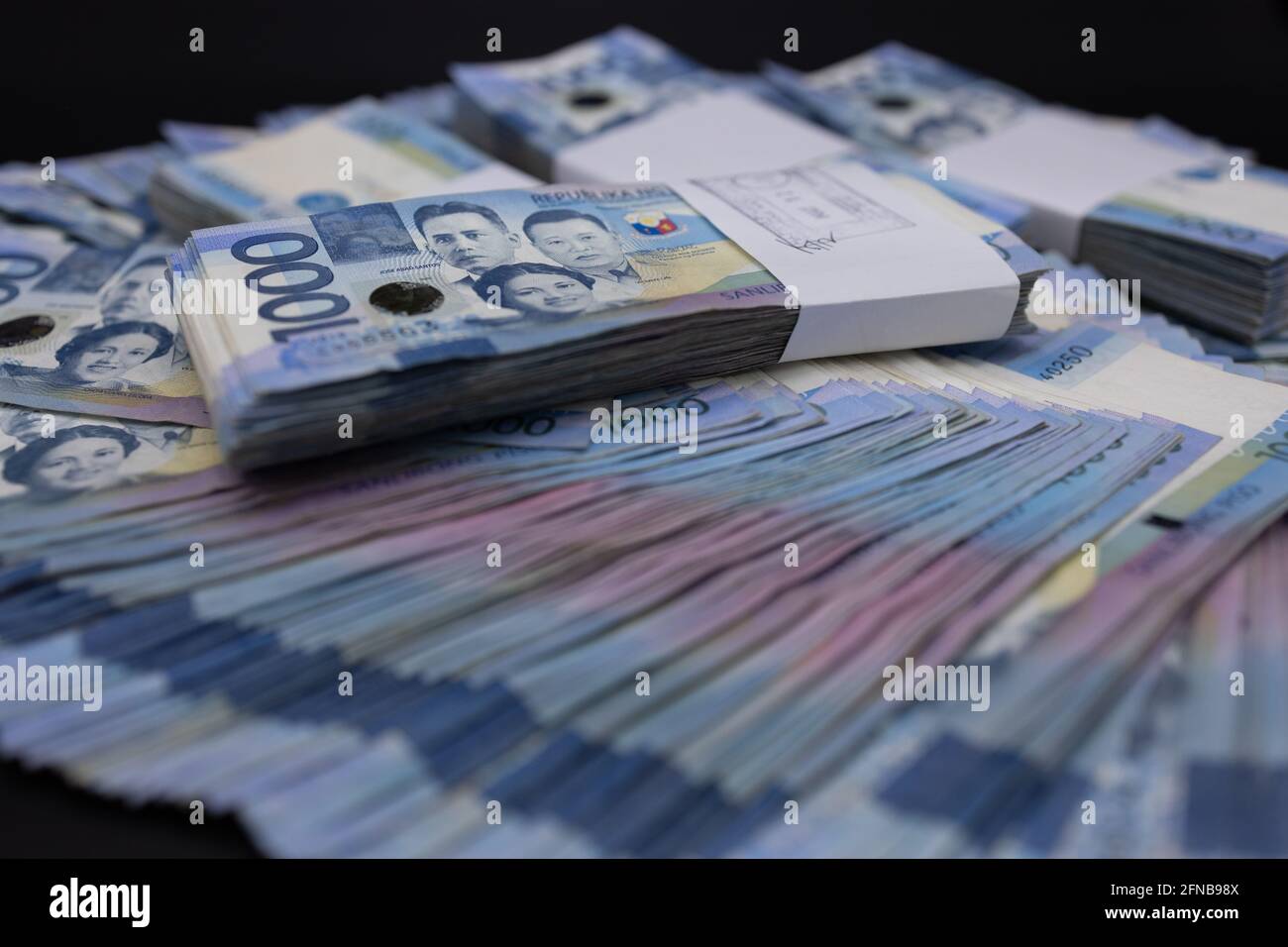 A pile of one thousand Philippines banknotes. Cash of Thousand dollar ...