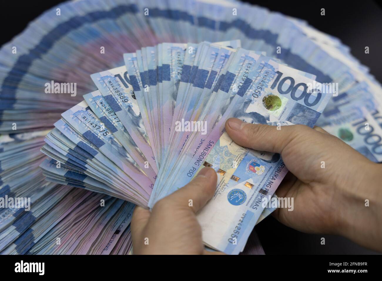 A pile of one thousand Philippines banknotes. Cash of Thousand dollar ...