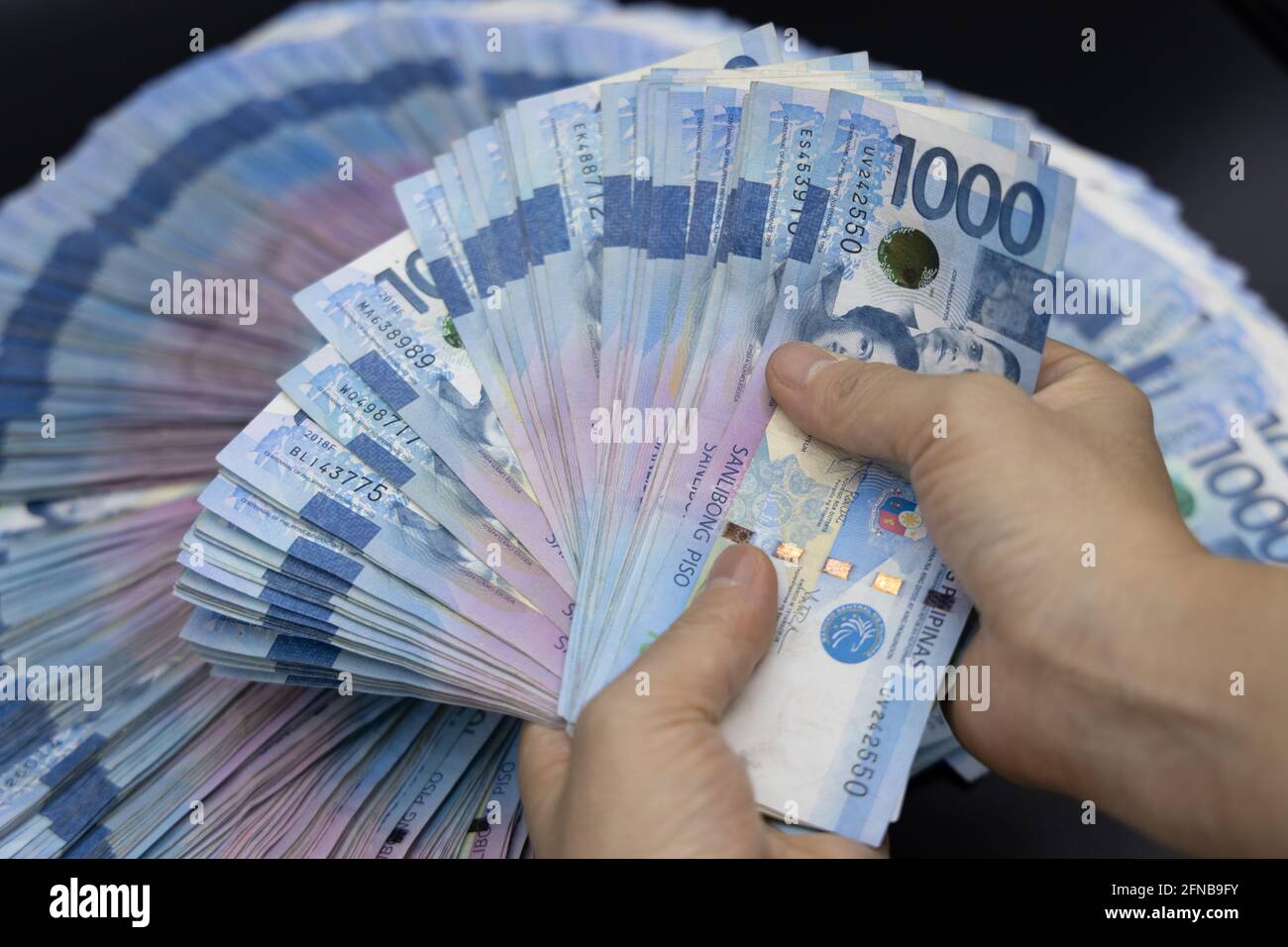 A pile of one thousand Philippines banknotes. Cash of Thousand dollar ...