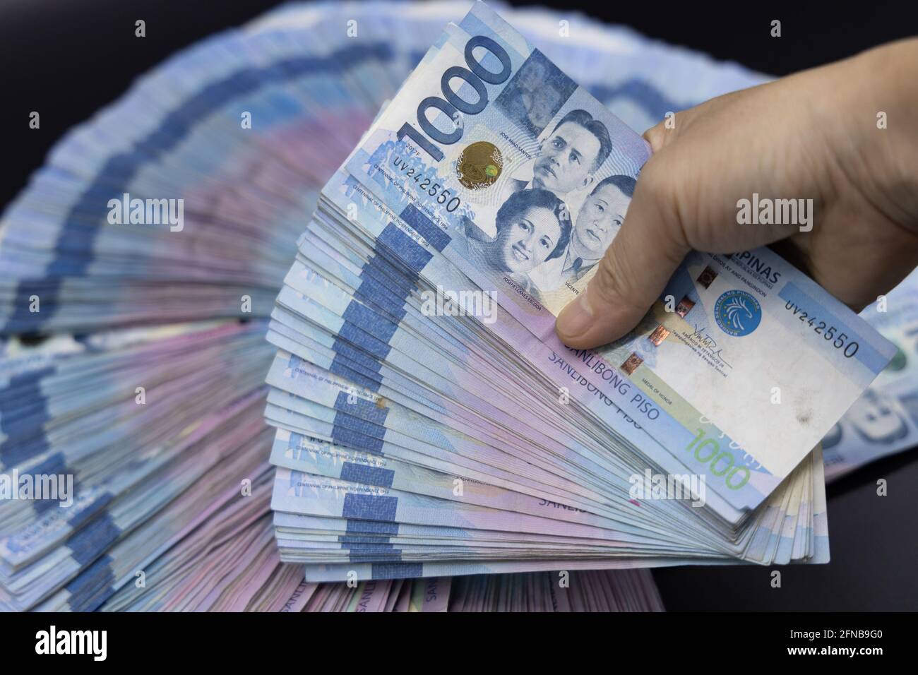 A pile of one thousand Philippines banknotes. Cash of Thousand dollar ...