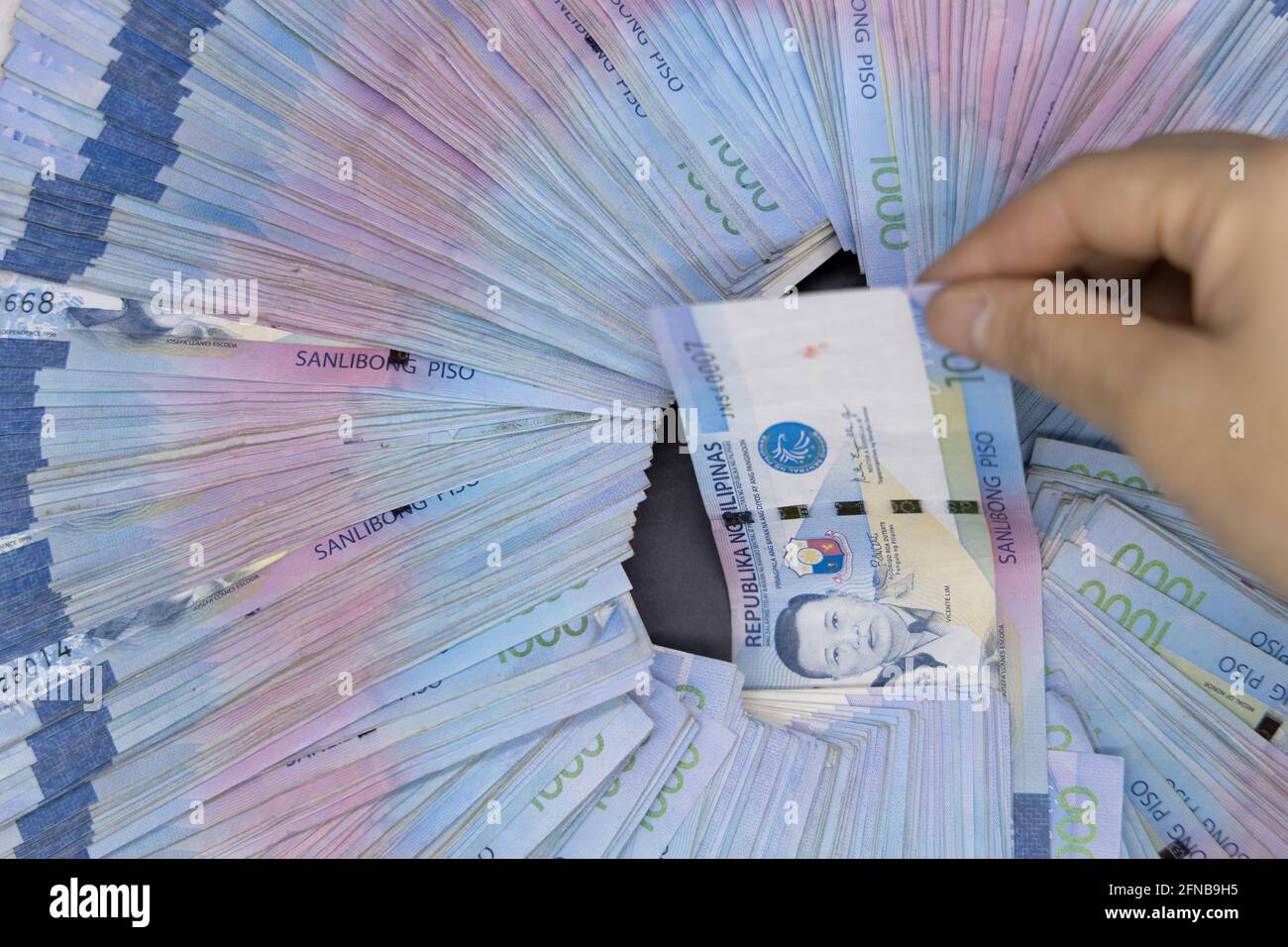 A pile of one thousand Philippines banknotes. Cash of Thousand dollar ...