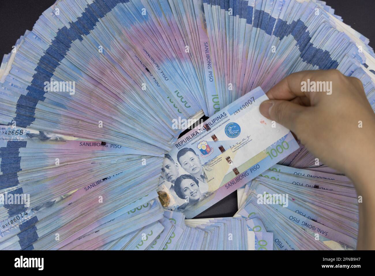 A pile of one thousand Philippines banknotes. Cash of Thousand dollar ...