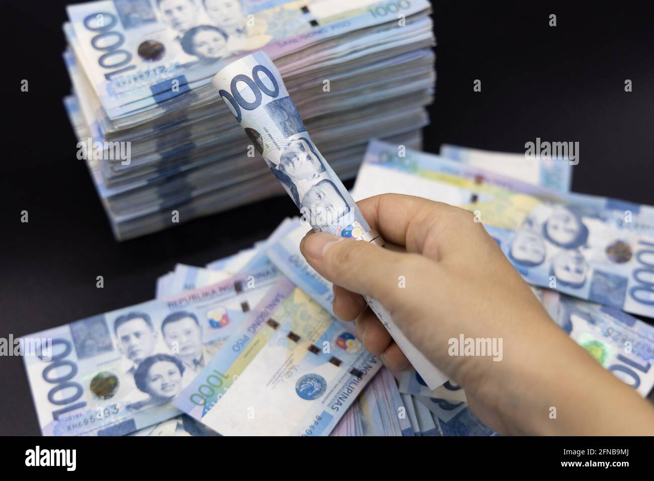 A pile of one thousand Philippines banknotes. Cash of Thousand dollar ...