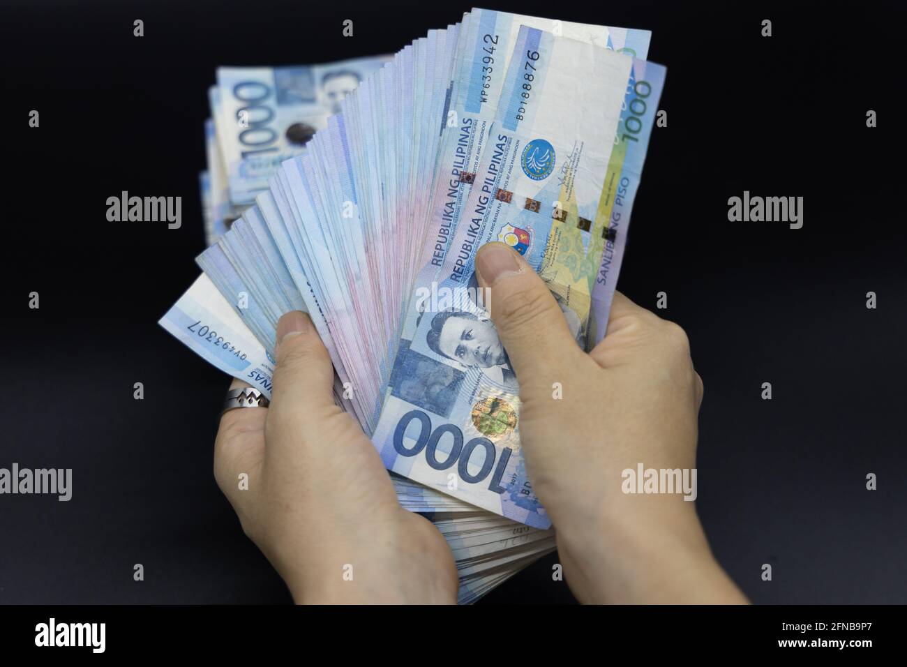 A pile of one thousand Philippines banknotes. Cash of Thousand dollar ...