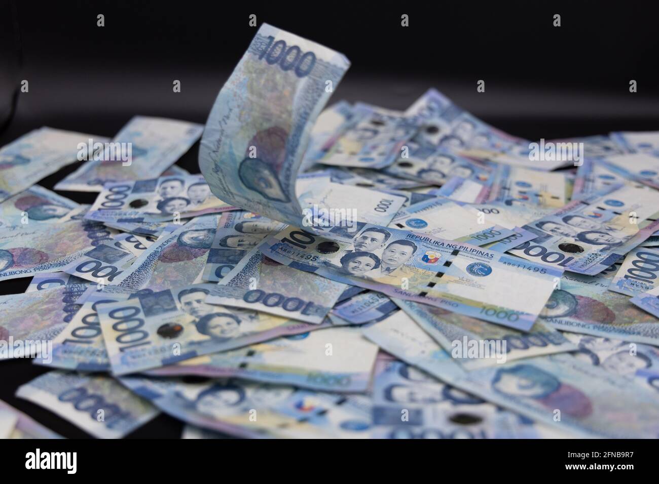 A pile of one thousand Philippines banknotes. Cash of Thousand dollar ...