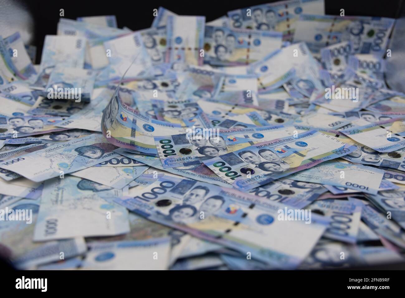 A pile of one thousand Philippines banknotes. Cash of Thousand dollar ...