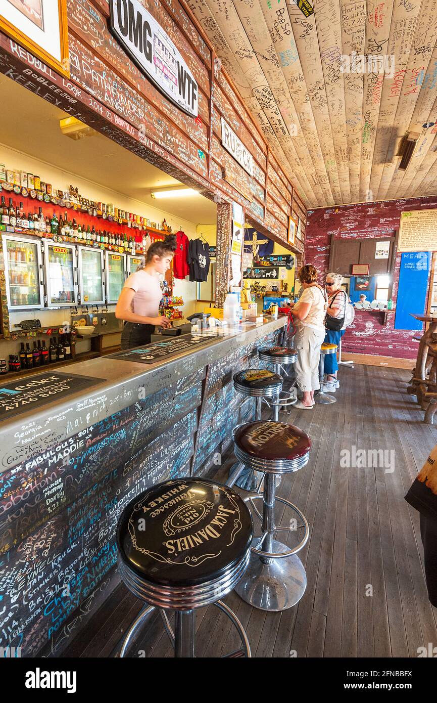 Young waitress serving customers at the iconic Blue Heeler Hotel ...