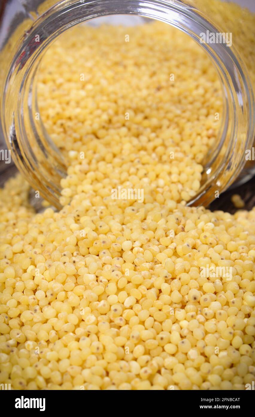 Millet groats containing natural minerals and dietary fiber. Wooden ...