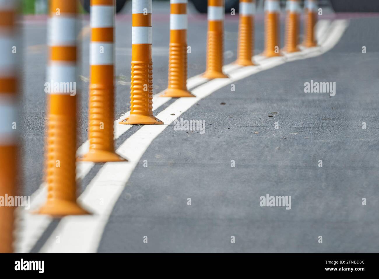 Flexible traffic bollard for bike lane Stock Photo - Alamy