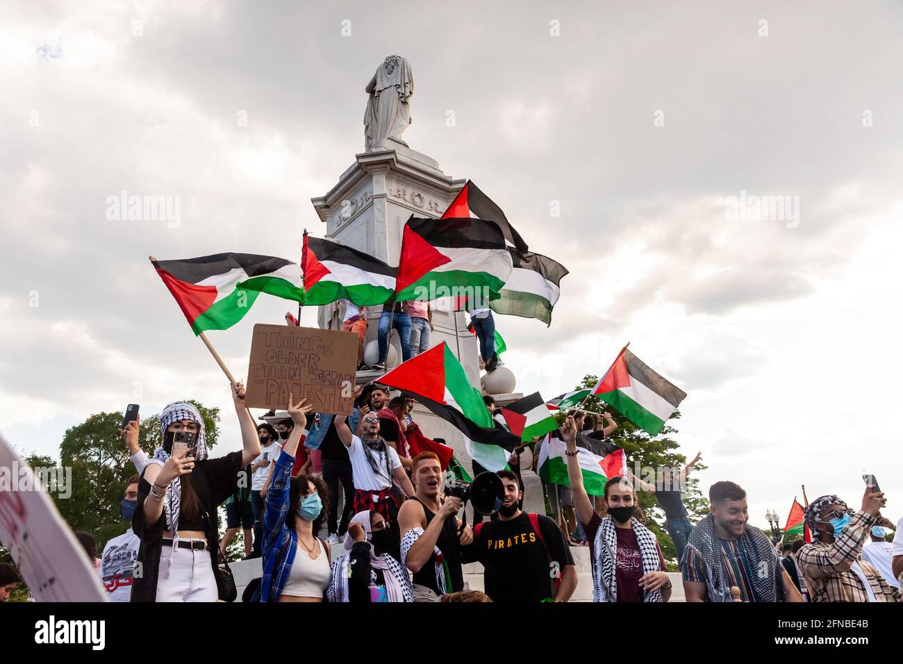 Washington, DC, USA. 15th May, 2021. Pictured: Protesters wave ...