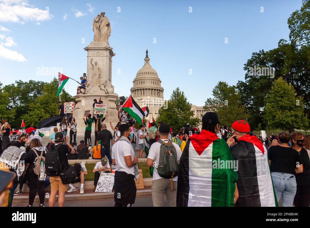 Washington, DC, USA. 15th May, 2021. Pictured: Two protesters stand ...