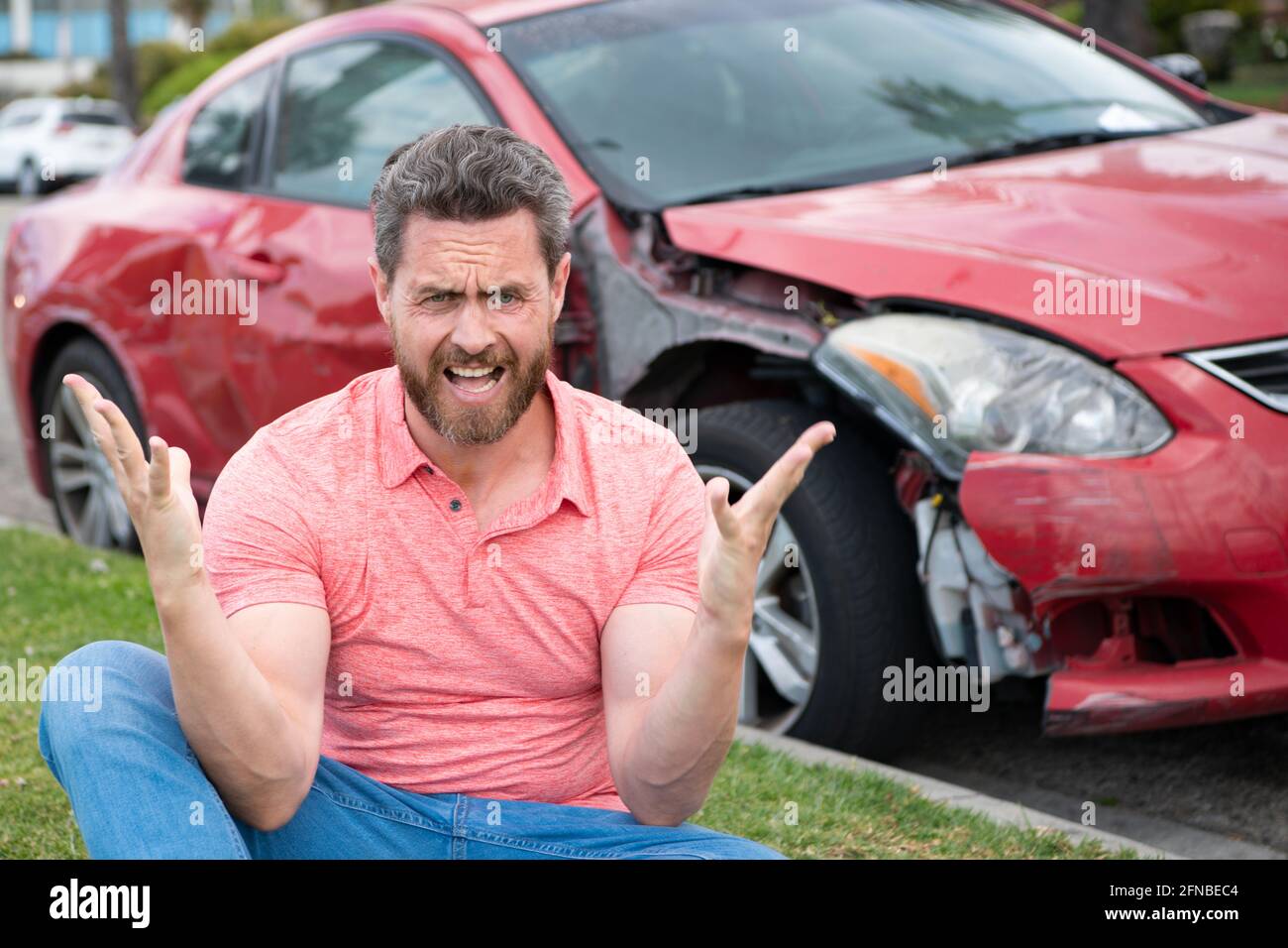 Upset driver man in front of automobile crash car collision accident ...