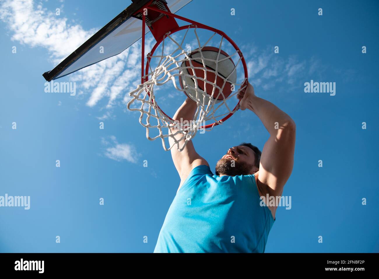 Basketball player. Sports and basketball. A young man jumps and throws ...