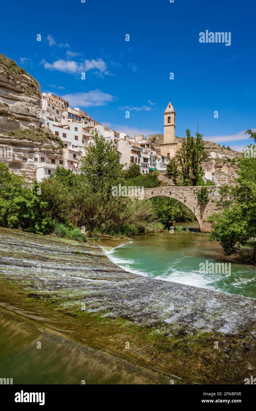 Alcala del Jucar, idyllic Spanish white town with a stone bridge over a ...