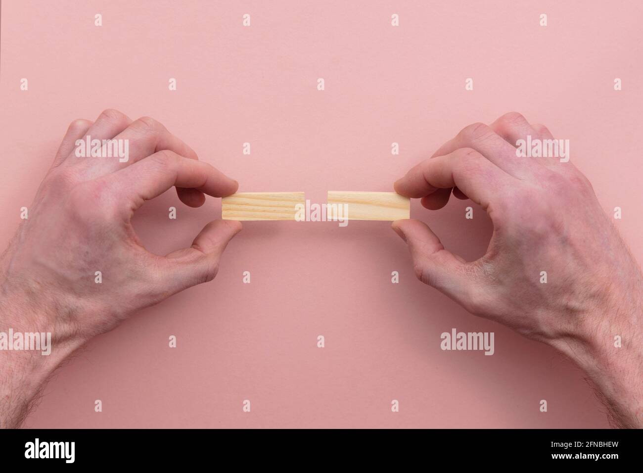 Hand comparing two wooden blocks. Business choice concept Stock Photo ...