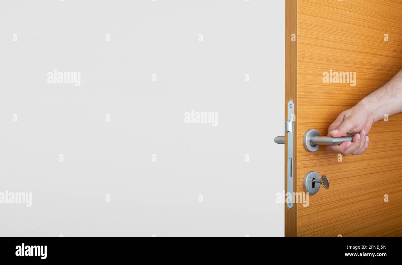 Hand holding door handle hi-res stock photography and images - Alamy