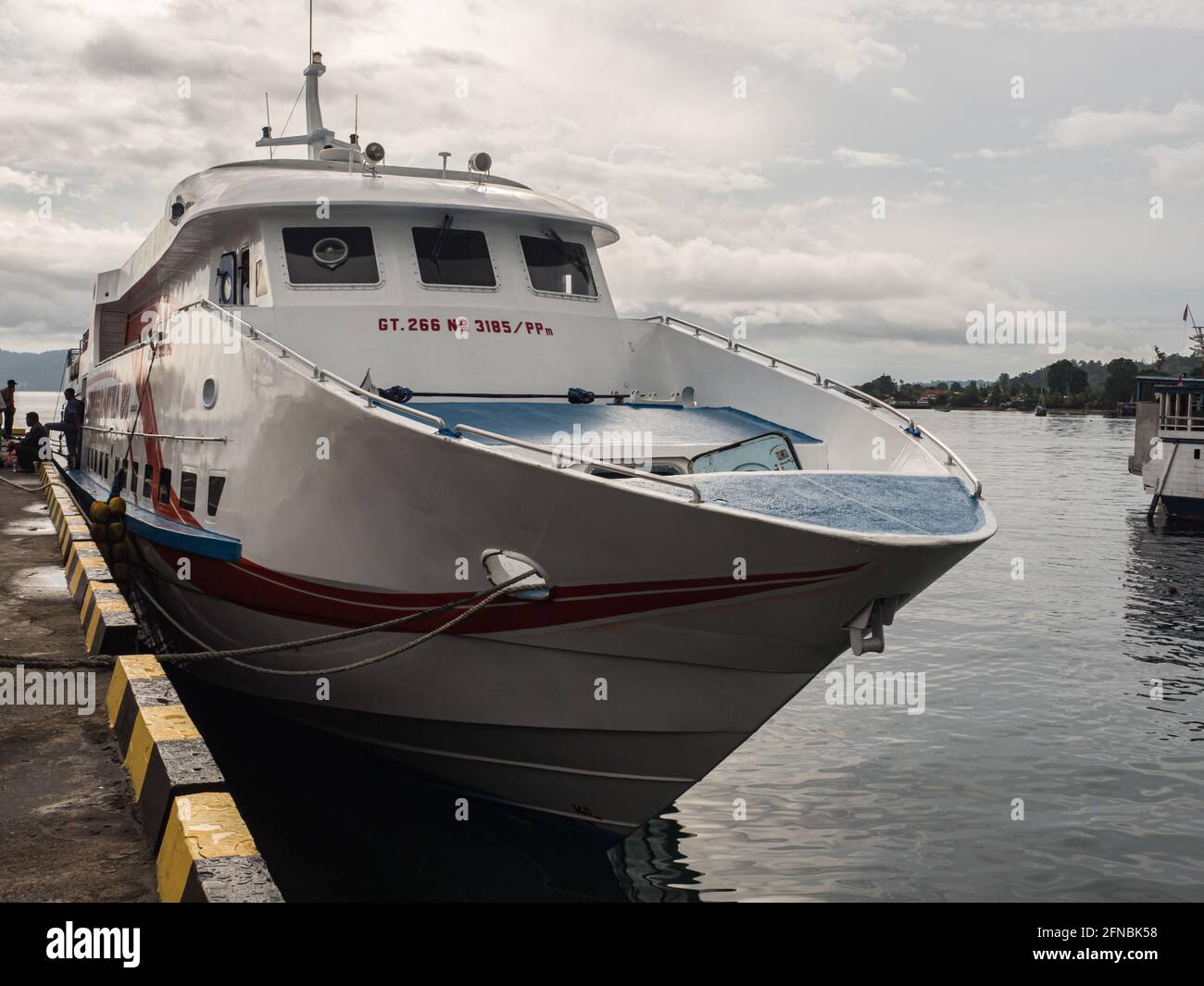 Ambon, Indonesia - February 15, 2018: A boat floating between the ...