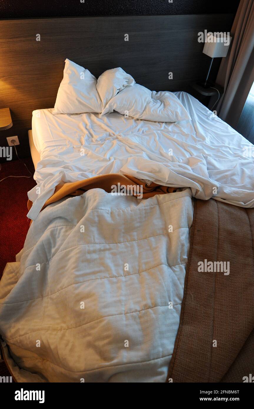 Unmade bed in an hotel room, Paris, Ile-de-France, France Stock Photo ...