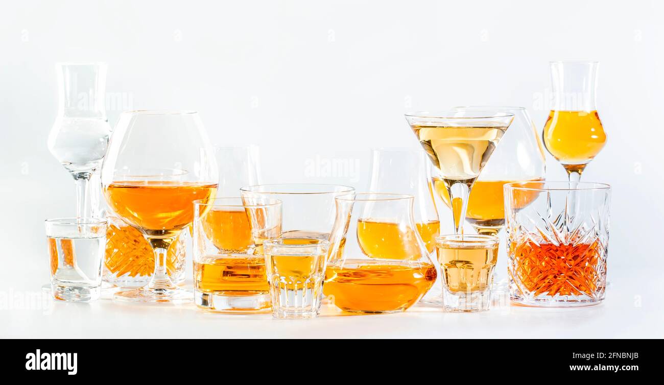 Hard strong alcoholic drinks, spirits and distillates in glasses in ...
