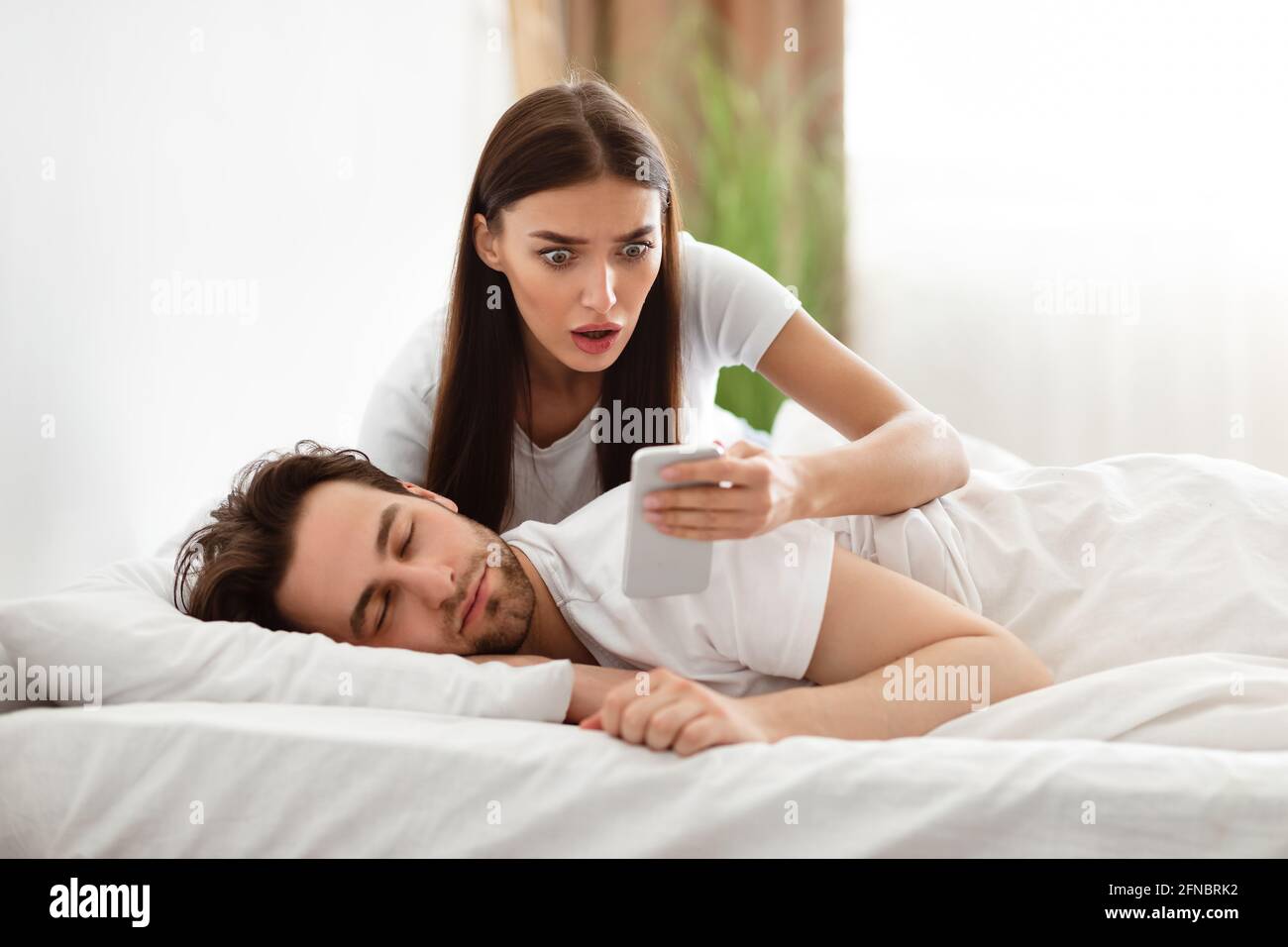 Shocked Girlfriend Reading Messages On Cheating Husband's Phone In ...