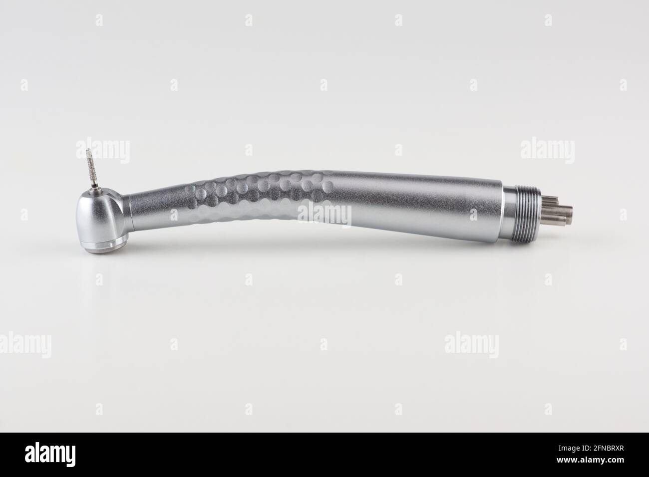 dental turbine handpiece isolated on white background Stock Photo - Alamy
