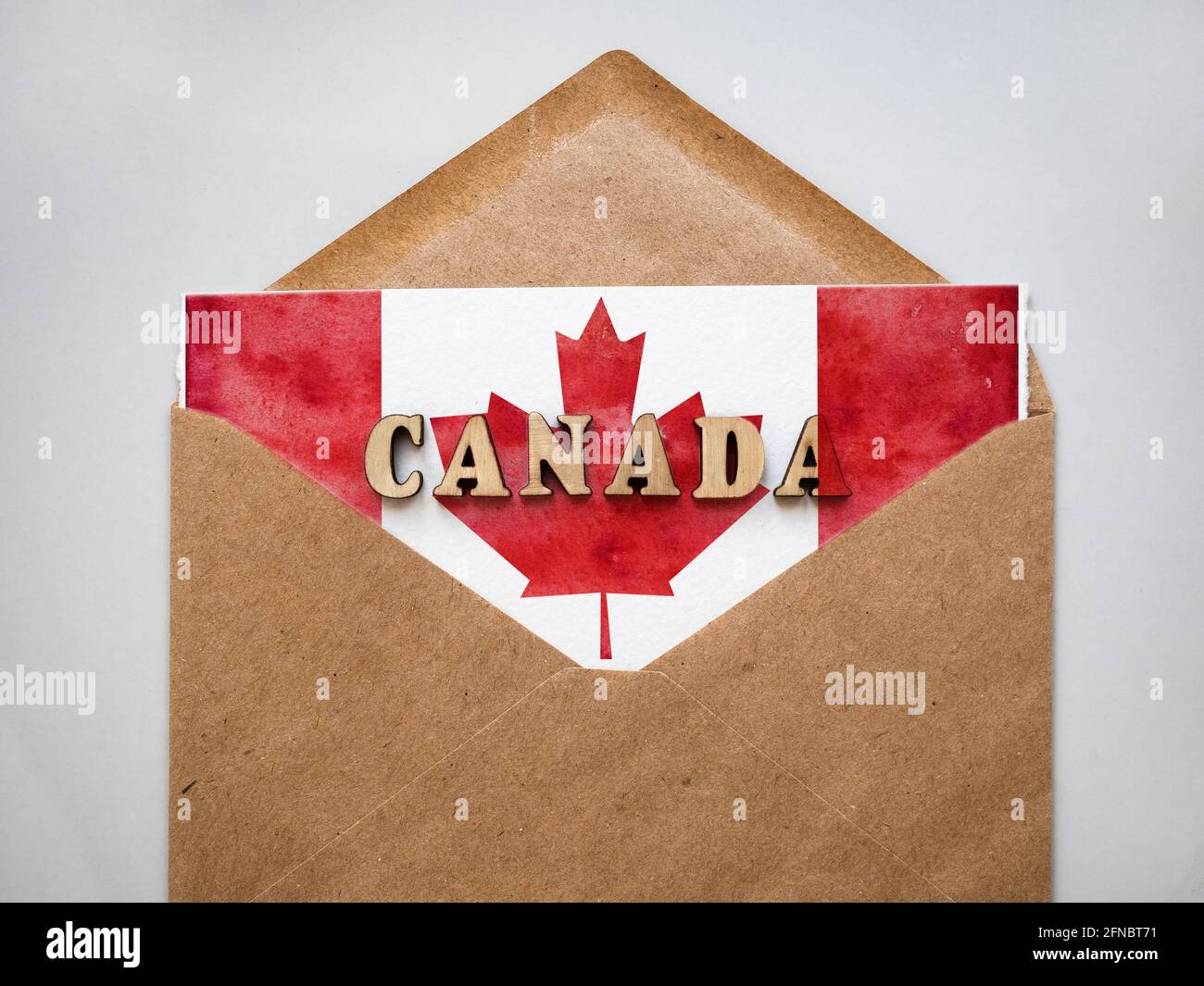 Happy Canadian Day. Postal envelope painted in the national colors of ...