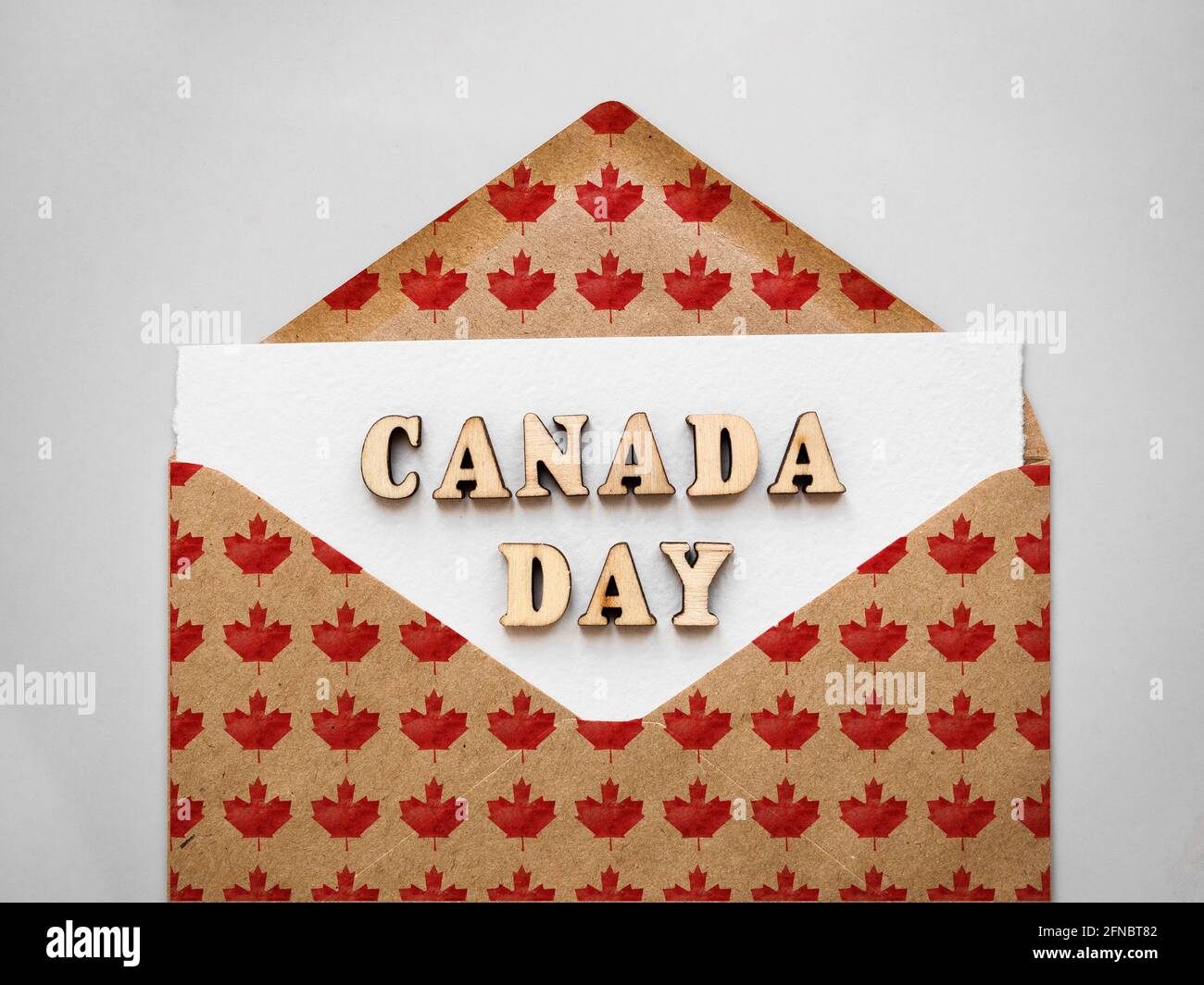 Happy Canadian Day. Postal envelope painted in the national colors of ...