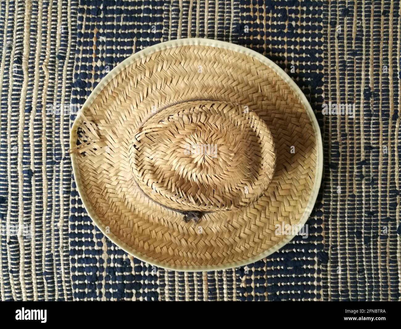 Damaged straw hat hi-res stock photography and images - Alamy