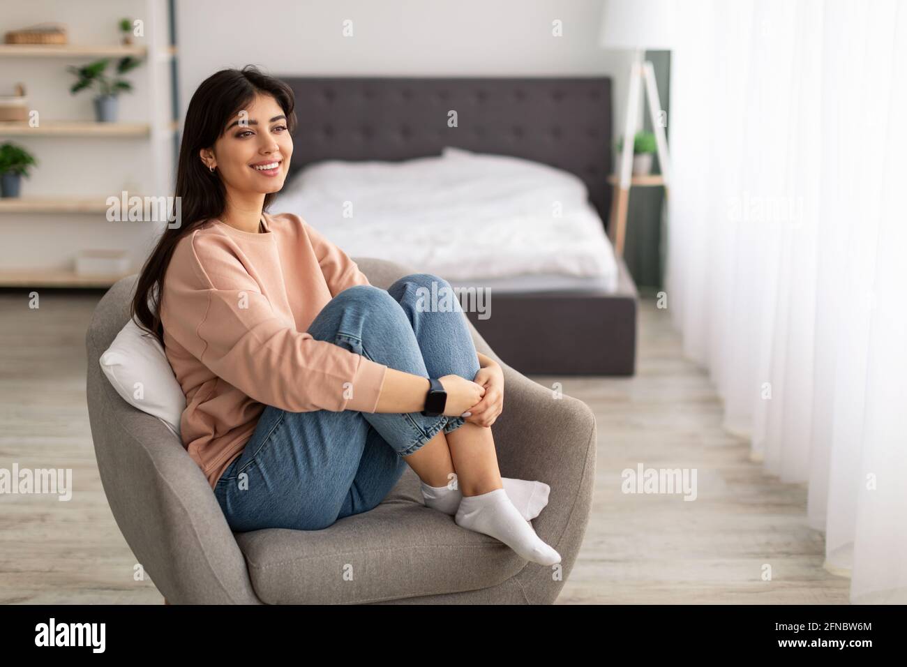 Beautiful woman home seated on hi-res stock photography and images - Alamy