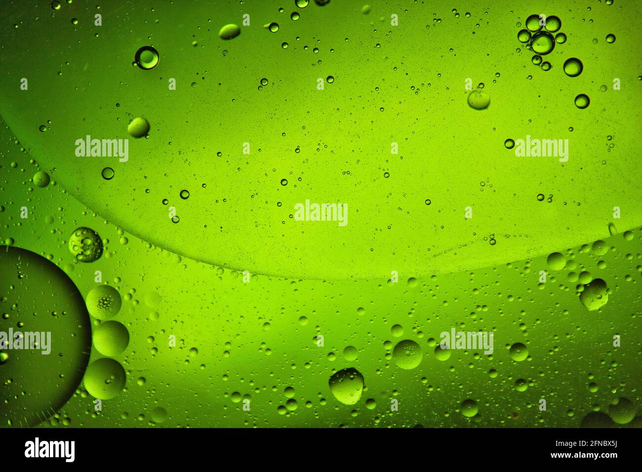 close-up view of a green liquid background of moving bubbles Stock ...