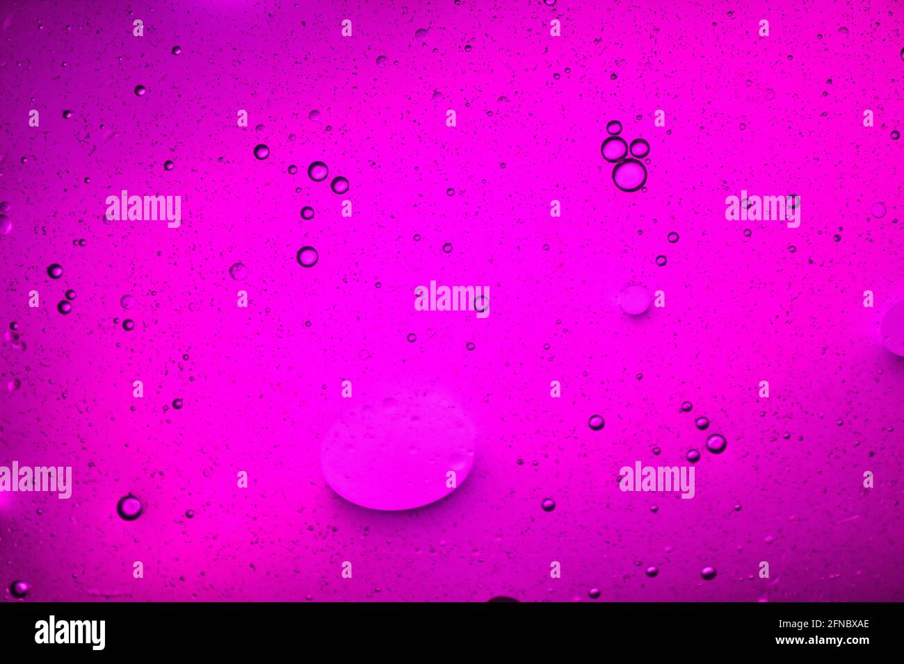 close-up view of a dark pink liquid background of moving bubbles Stock ...