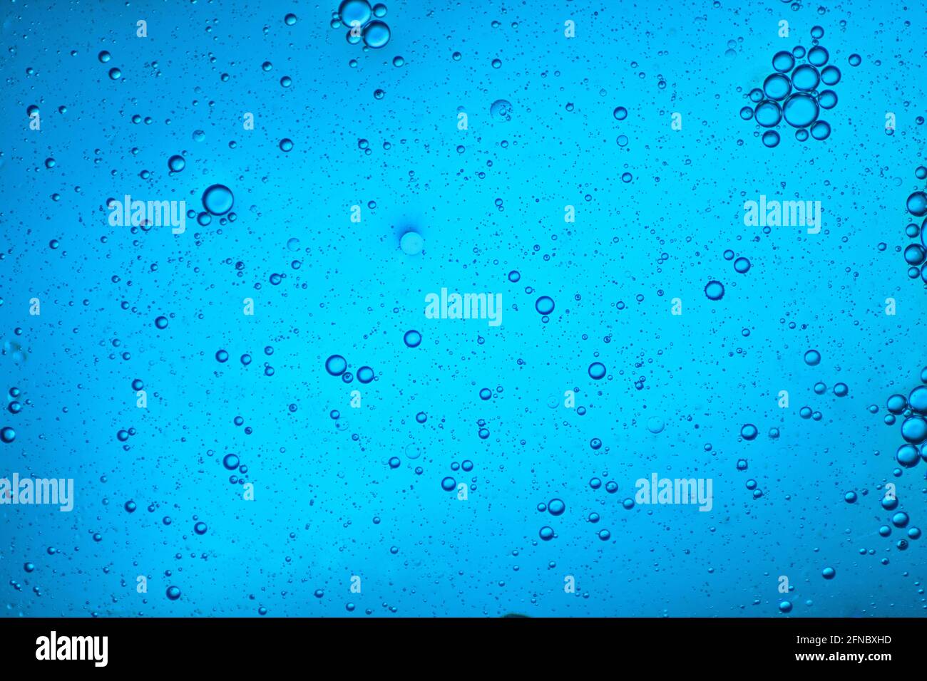 close-up view of a light blue liquid background of moving bubbles Stock ...