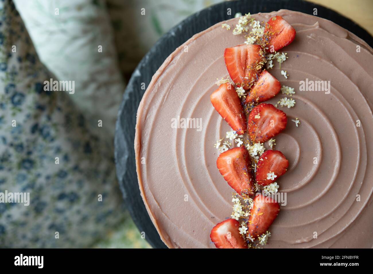 Ruby chocolate cake decorated with strawberries Stock Photo - Alamy