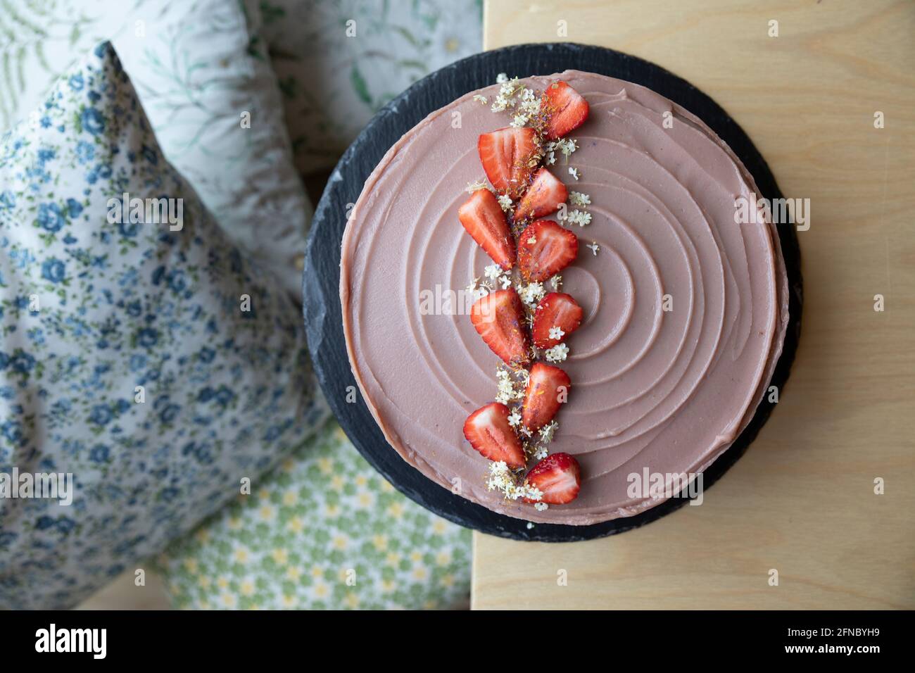 Ruby chocolate cake decorated with strawberries Stock Photo - Alamy