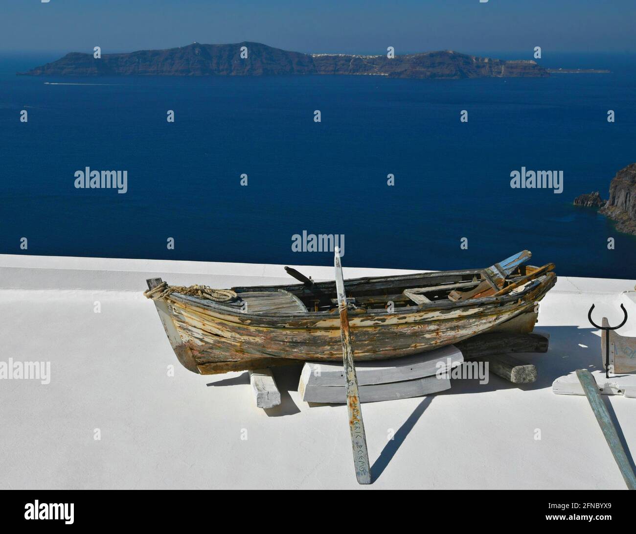 Scenic landscape with an old traditional Greek fishing boat on the ...