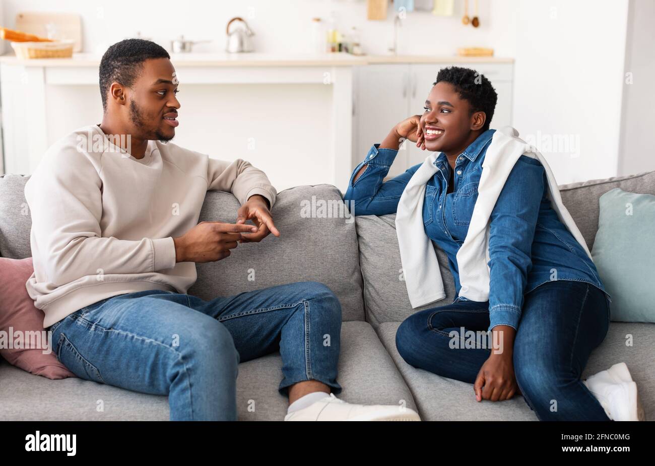 Black couple talking and spending time together resting on couch Stock ...