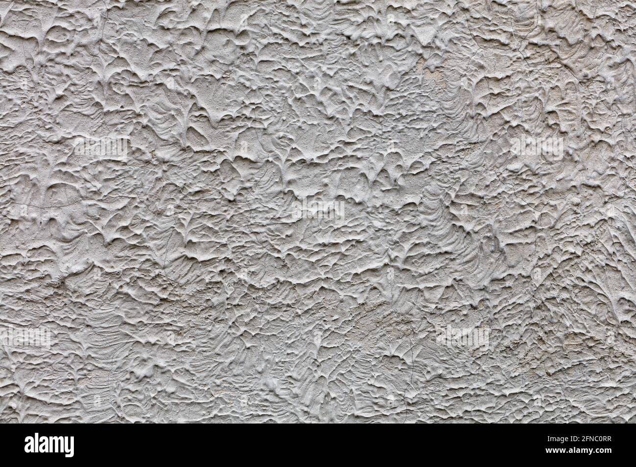 Texture and background of a rough concrete wall covered with a cured ...