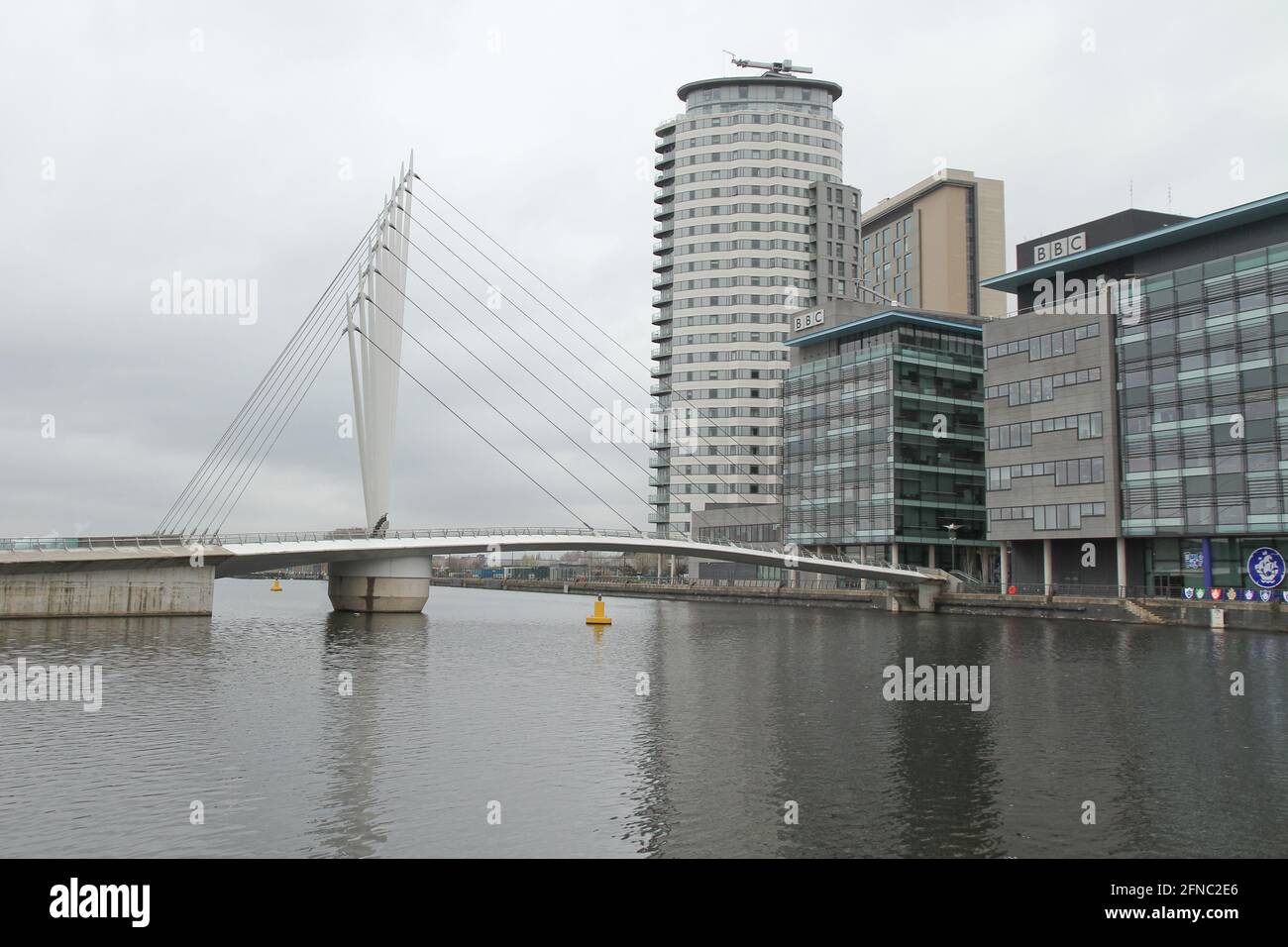 Riverside view of Media City Bridge across to BBC Studios at Trafford ...
