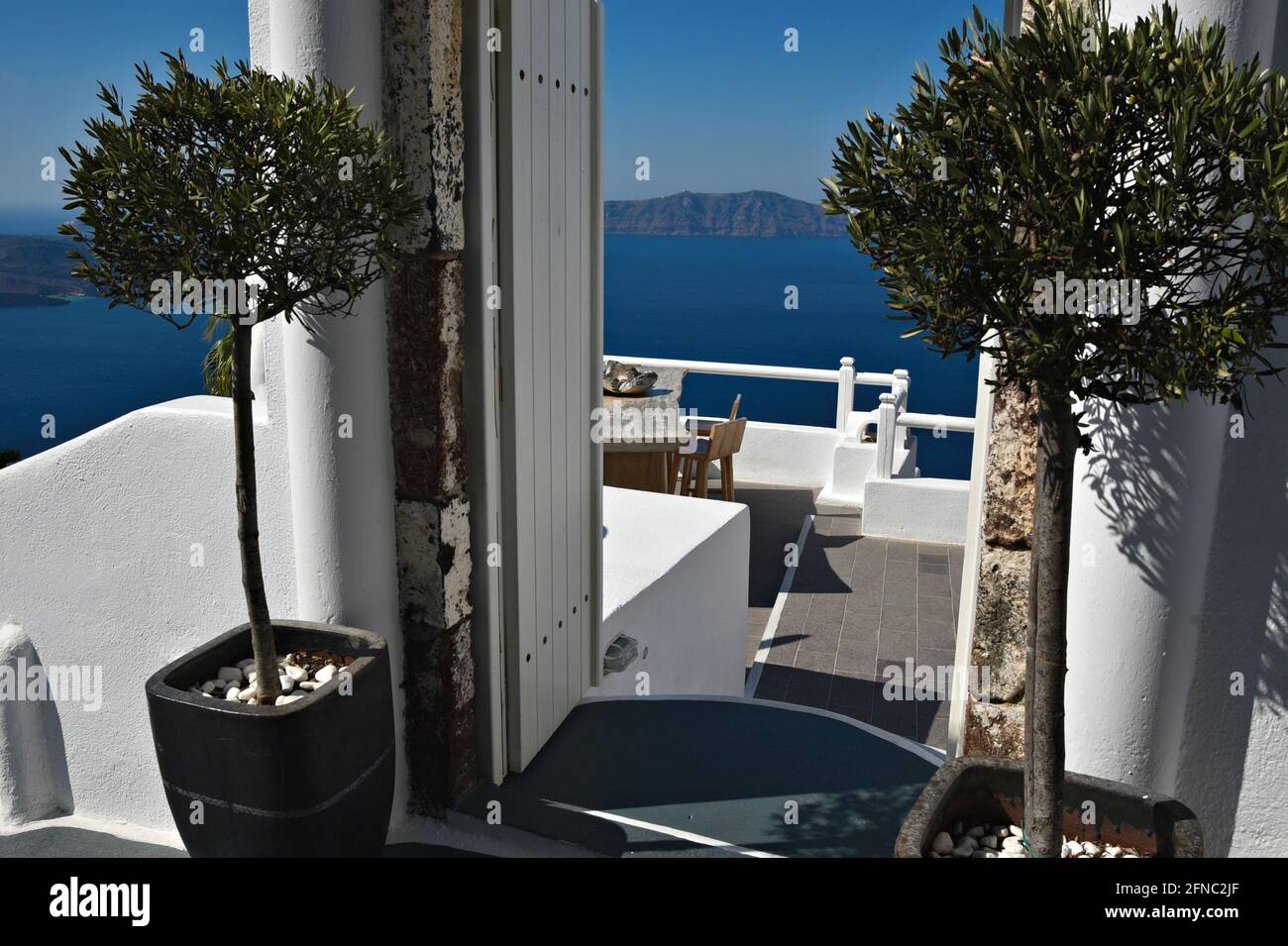 Scenic landscape through a Cycladic house entrance overlooking the ...